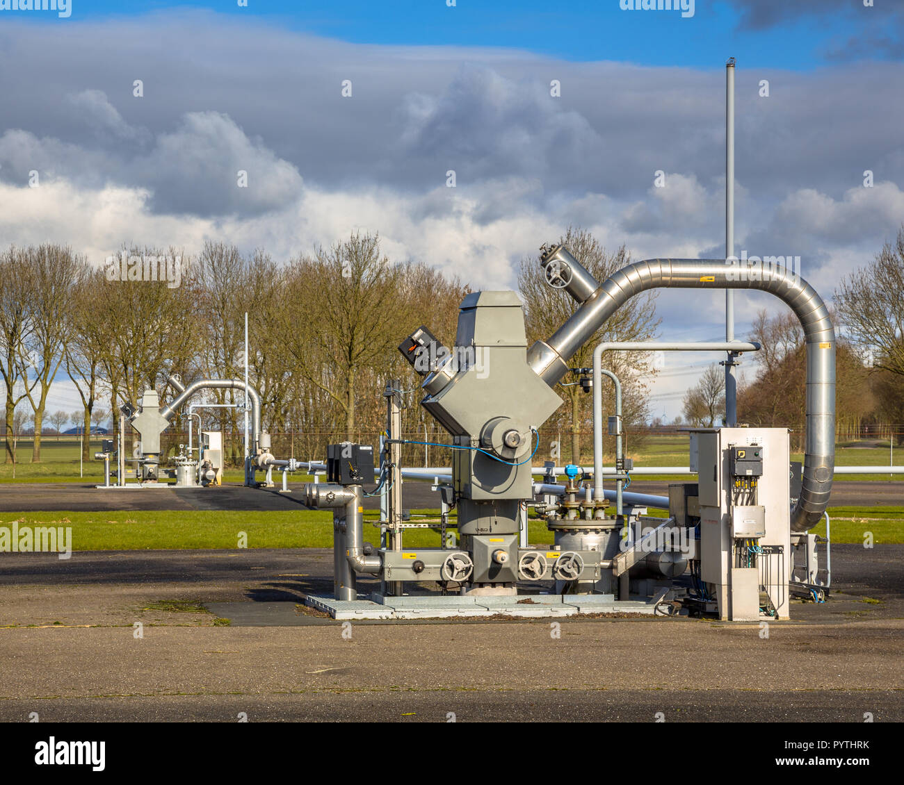 Modern Oil Wellheads on Natural gas field processing site Stock Photo ...