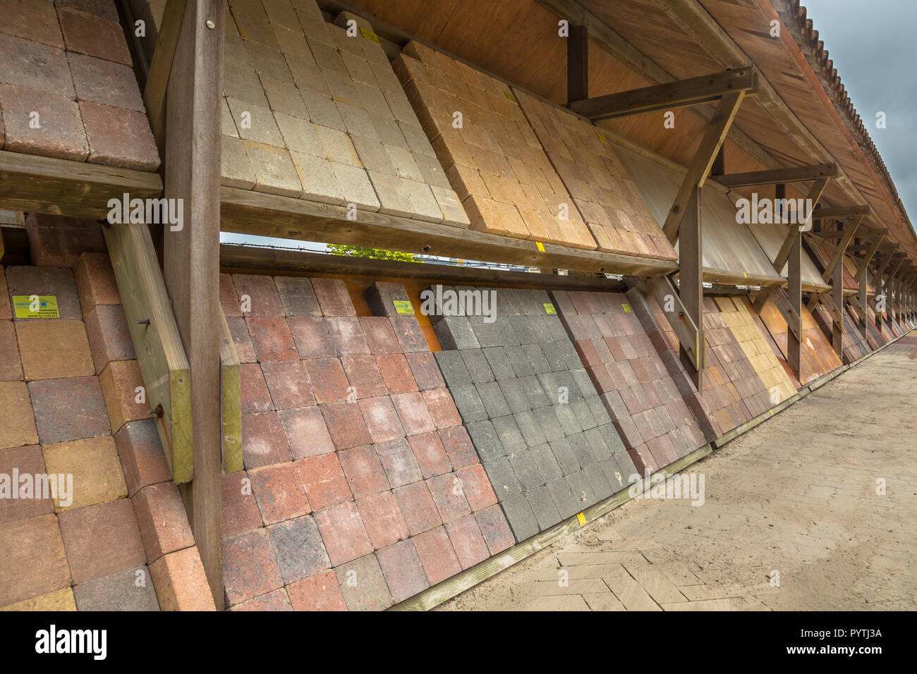 Display of decorative paving stones and road bricks at a stoneyard shop ...
