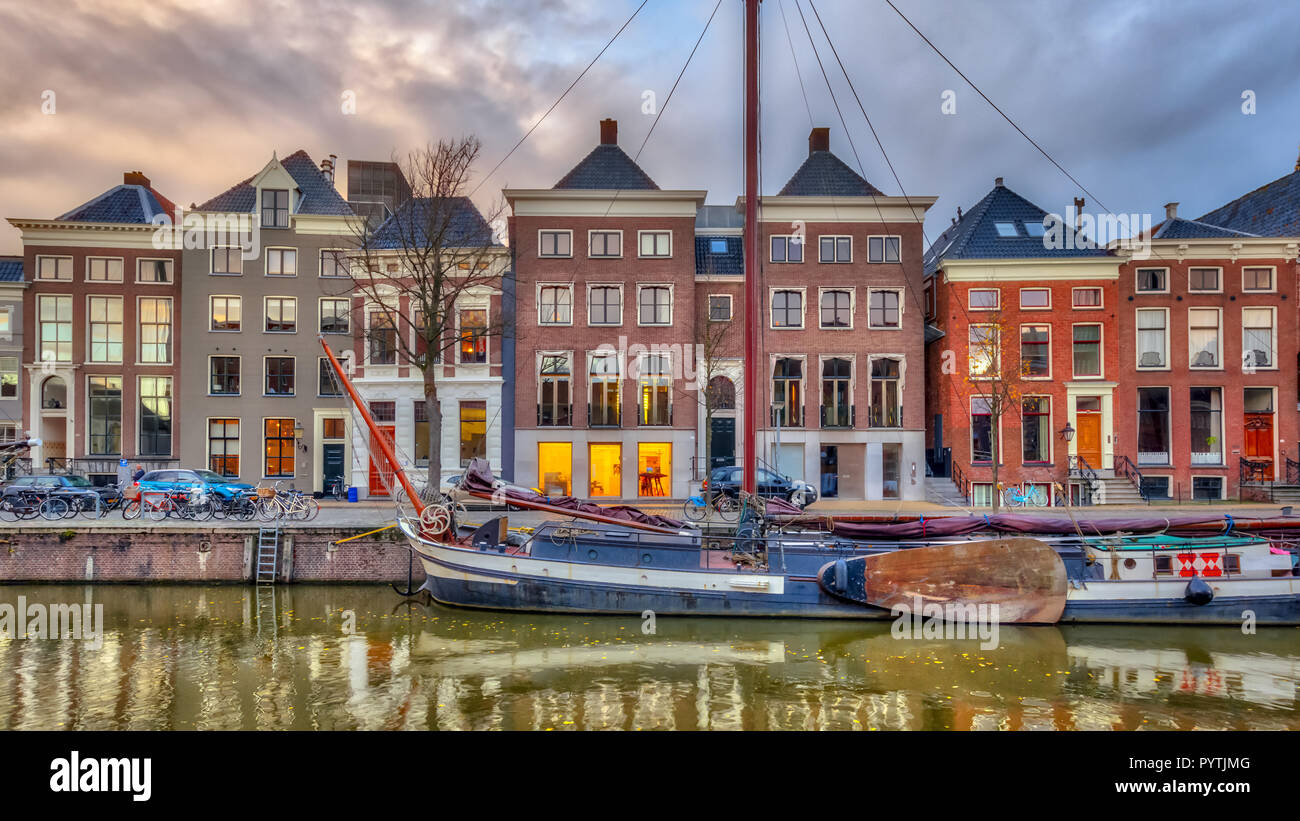 Old buildings on Hoge der Aa Quay with ship in Groningen city centre at ...