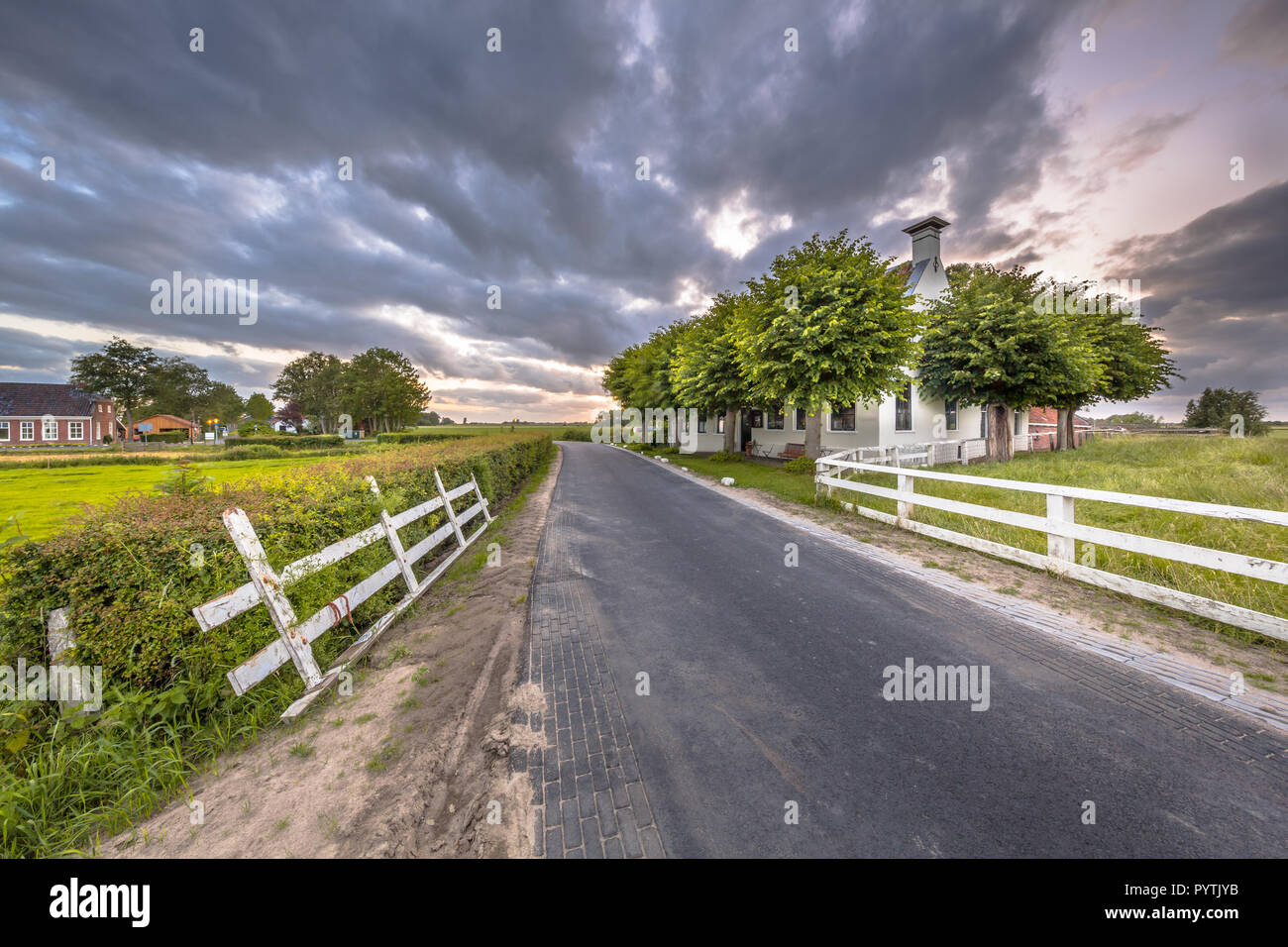 Road and fences in old dutch countryside of UNESCO world heritage area ...