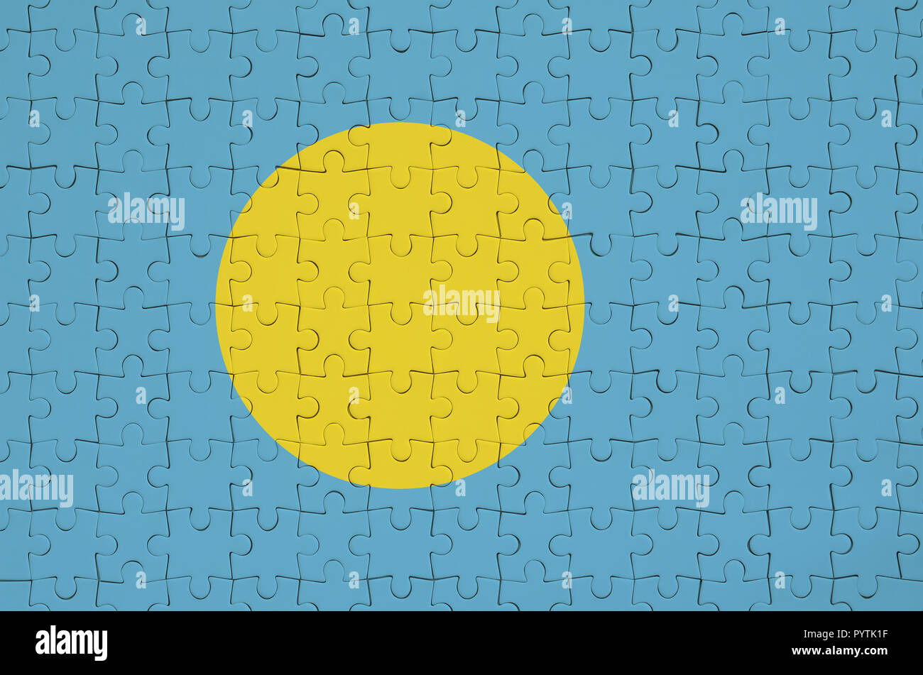 Palau flag is depicted on a folded puzzle Stock Photo - Alamy