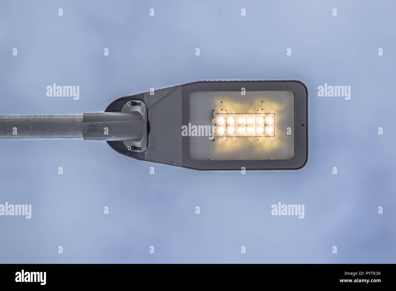 Modern LED street light lamp body with clouded sky in the background ...