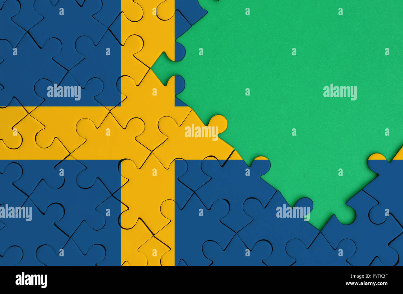 Sweden flag is depicted on a completed jigsaw puzzle with free green ...