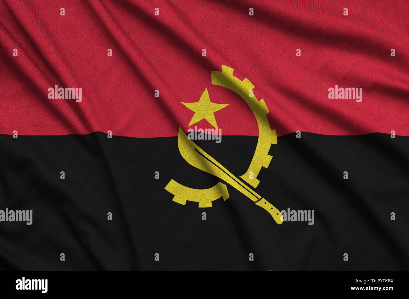 Angola flag is depicted on a sports cloth fabric with many folds. Sport ...
