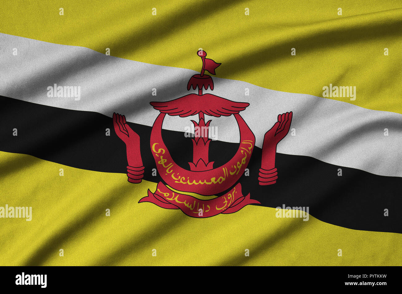 Brunei Darussalam flag is depicted on a sports cloth fabric with many ...