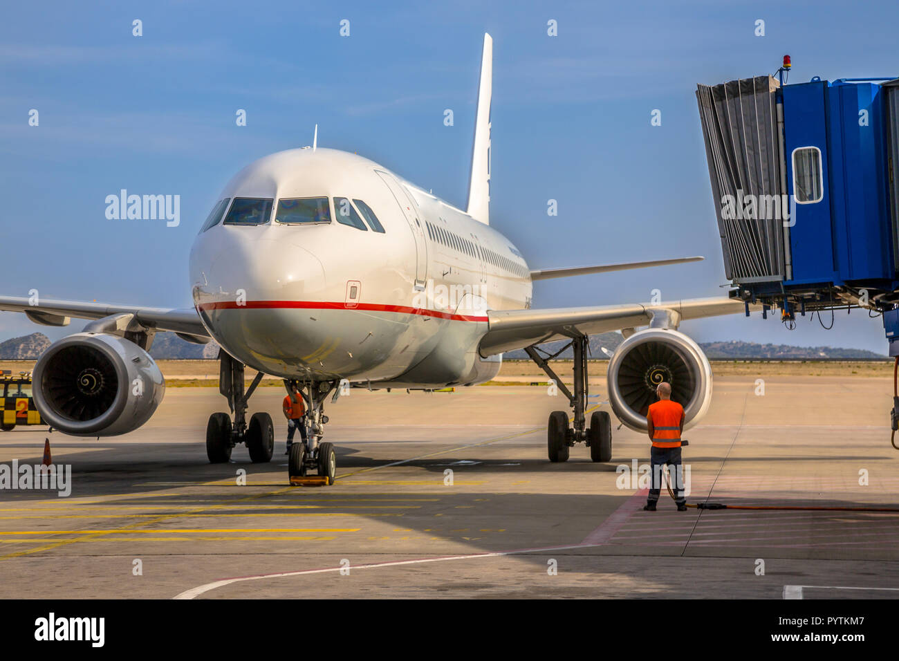 Passenger jet airplane arriving on gate terminal on international ...