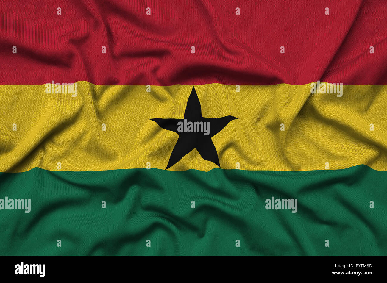 Ghana flag is depicted on a sports cloth fabric with many folds. Sport ...
