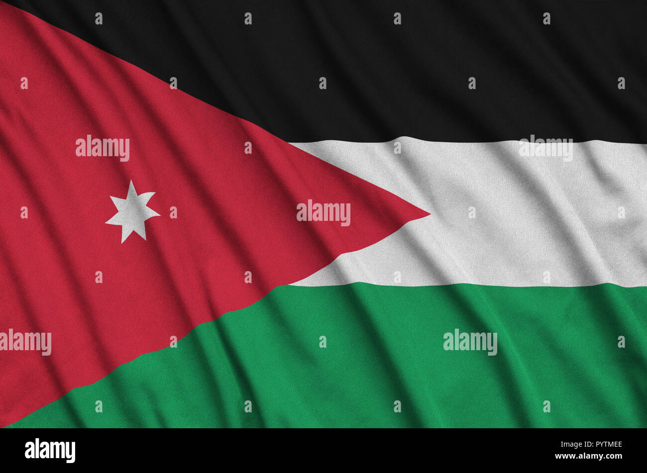 Jordan flag is depicted on a sports cloth fabric with many folds. Sport ...