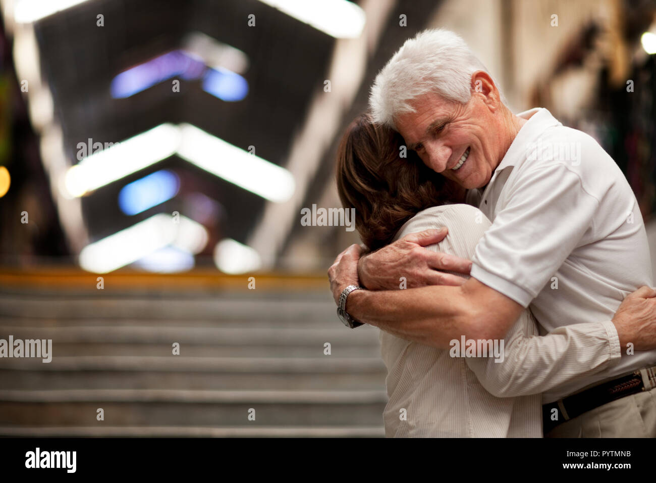 Happy married couple hugging Stock Photo - Alamy