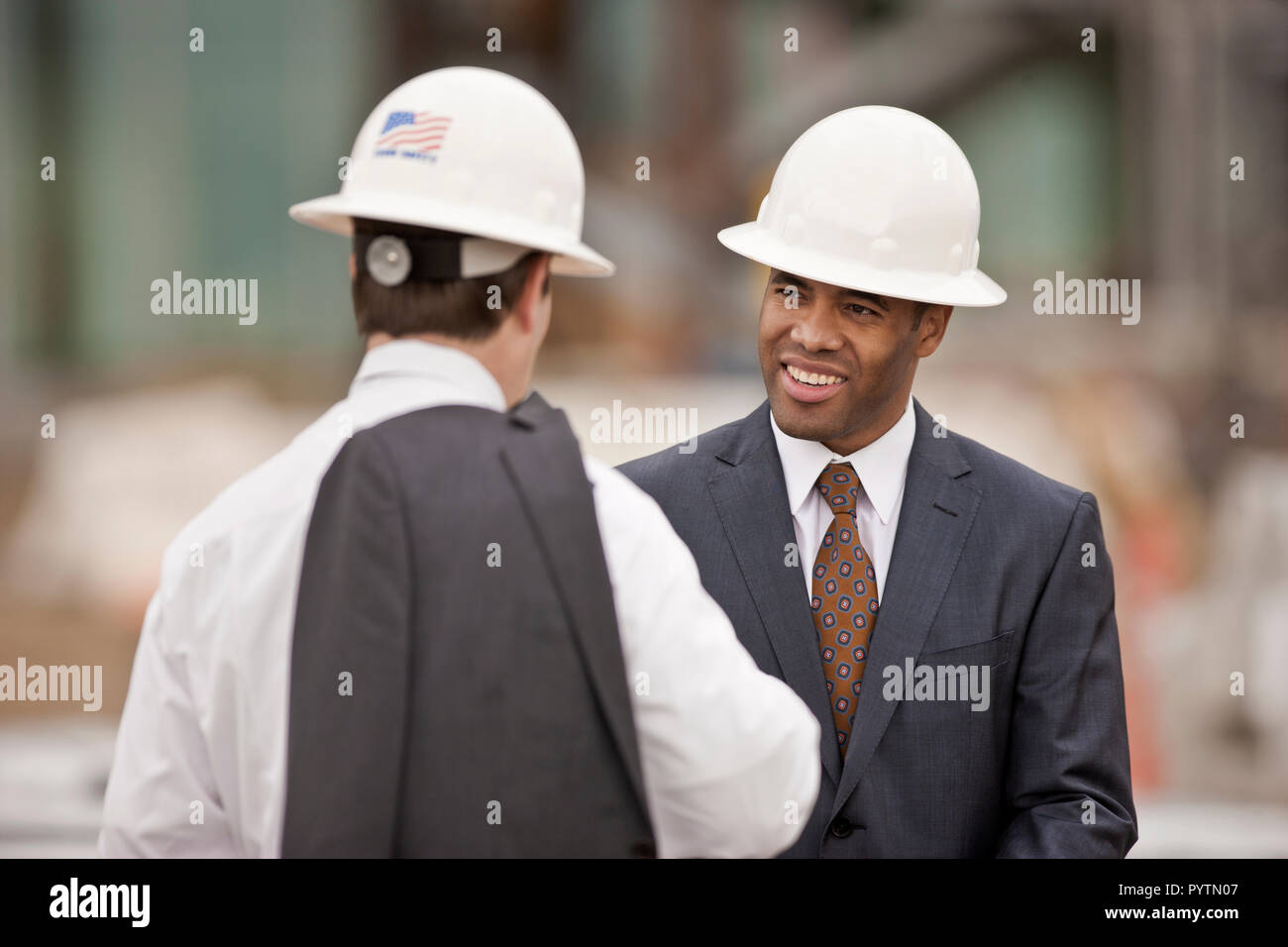 Wearing suits hi-res stock photography and images - Alamy