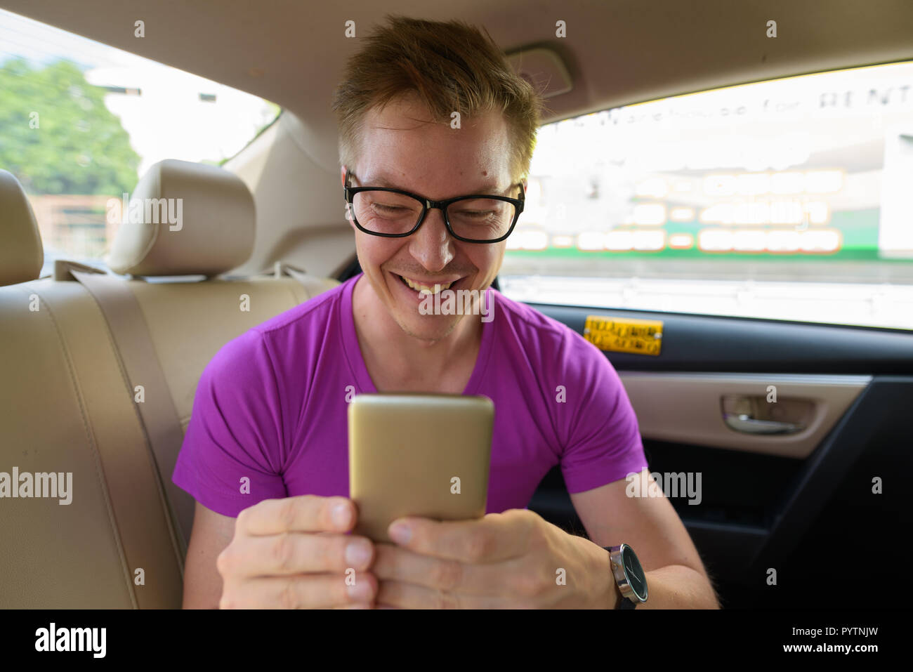 Handsome man holding phone in hi-res stock photography and images - Alamy