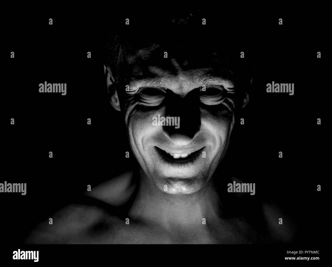 Stylish portrait of adult caucasian man. He smiles like maniac and ...