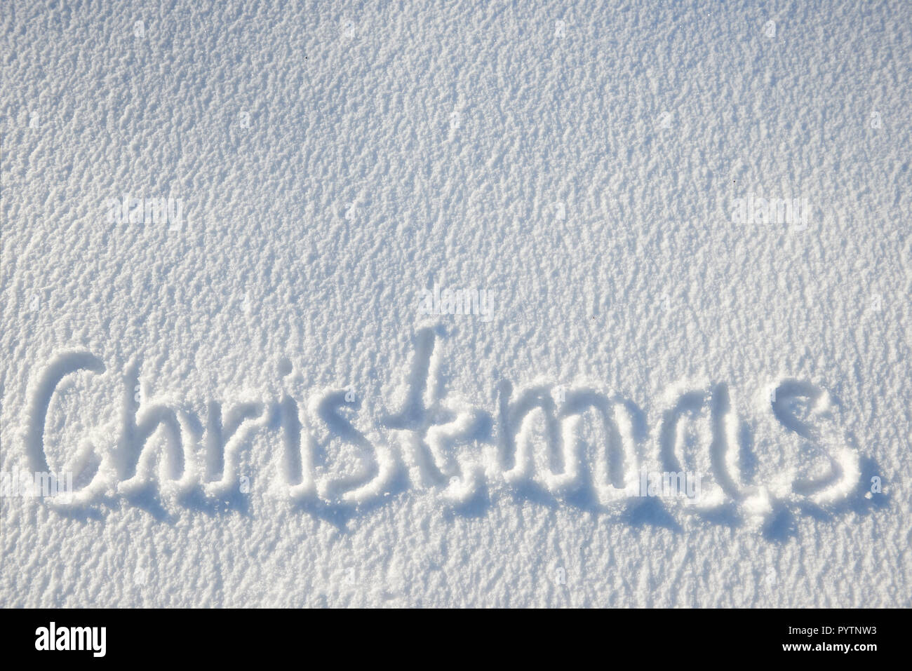 Christmas text written on snow for texture or background - winter ...