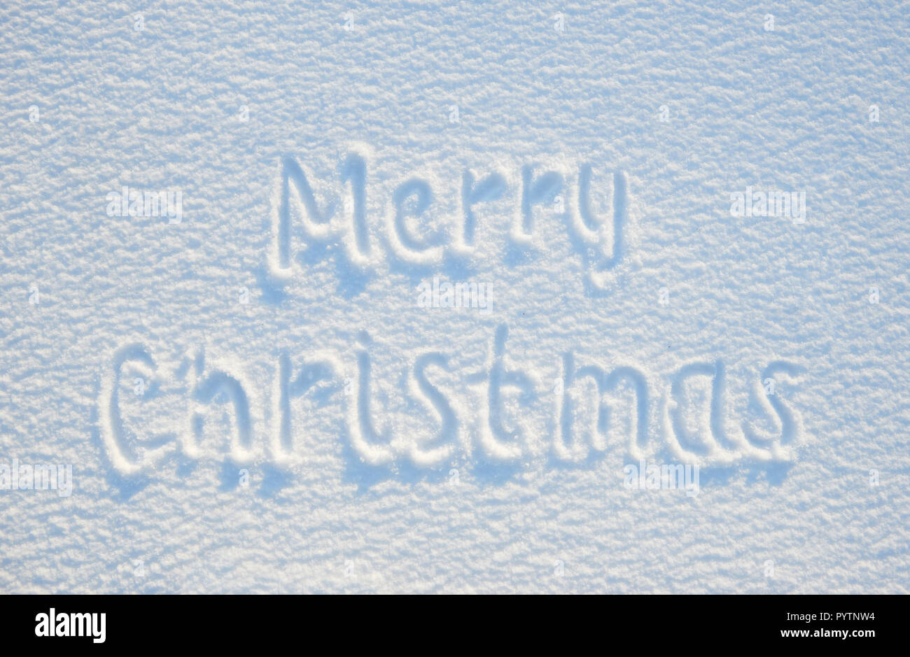 Merry christmas text written on snow for texture or background - winter ...