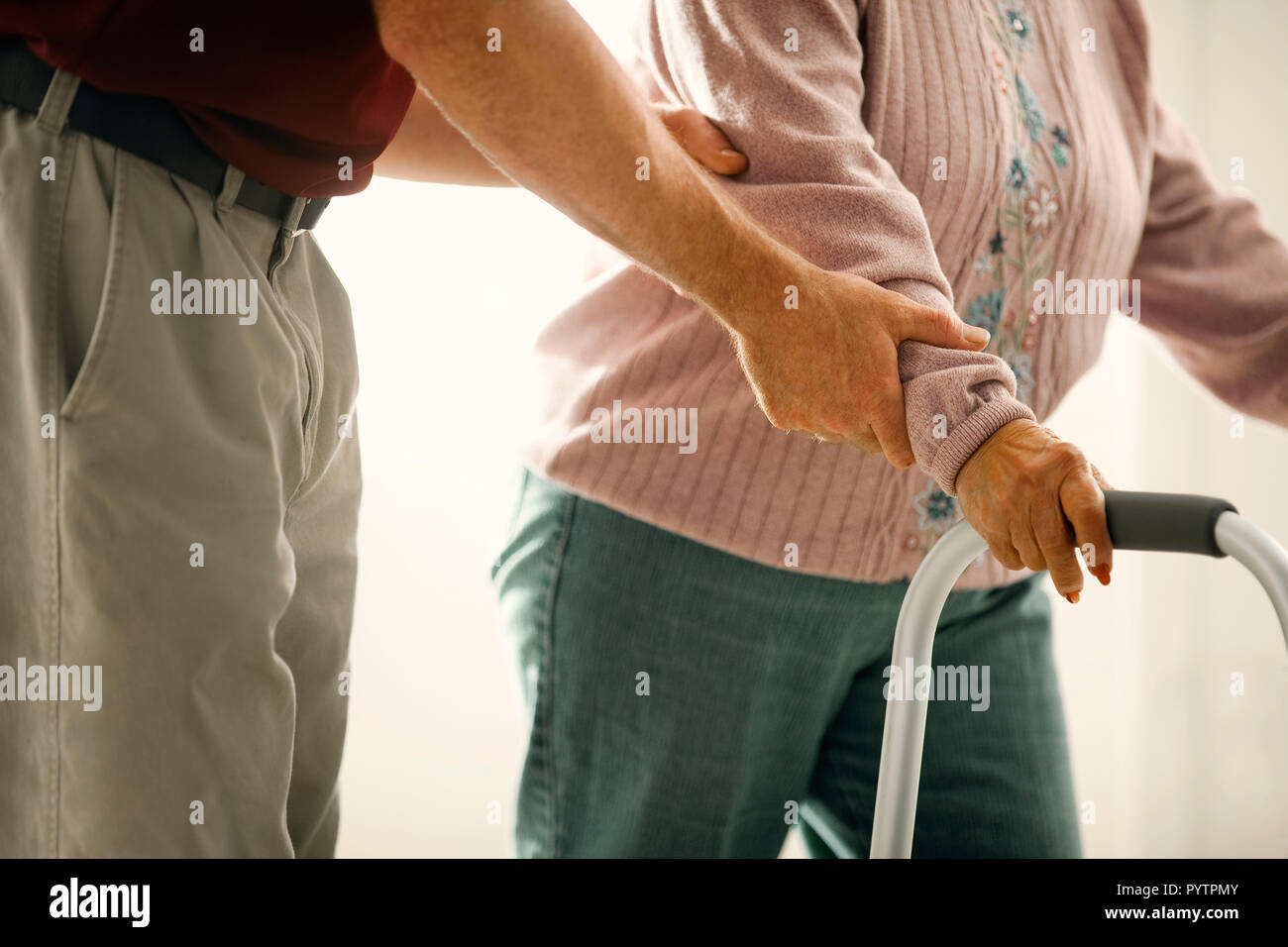 Using walking frame using walking aid hi-res stock photography and ...