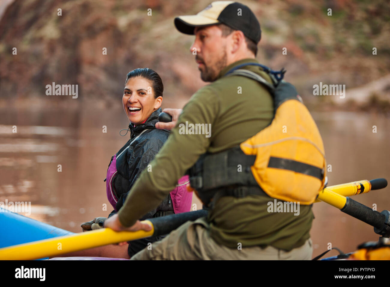 Portrait of a smiling woman on a raft Stock Photo - Alamy