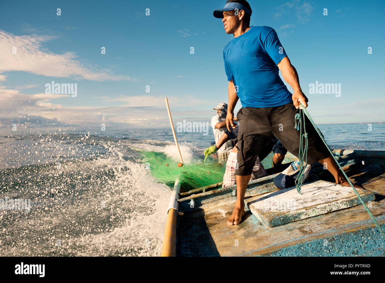 Fishermen at sea Stock Photo - Alamy