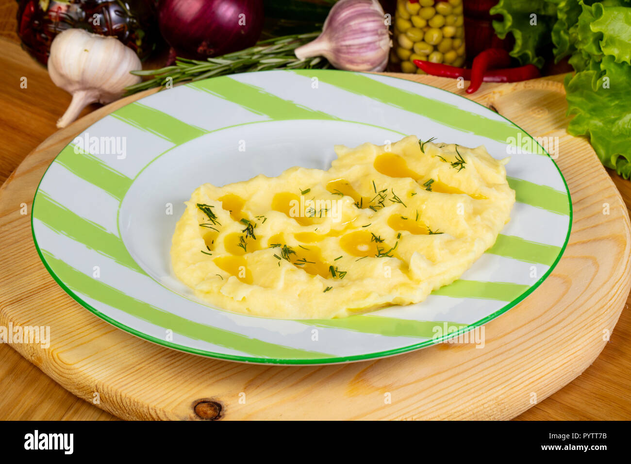 Mashed potato in the plate with herbs Stock Photo - Alamy