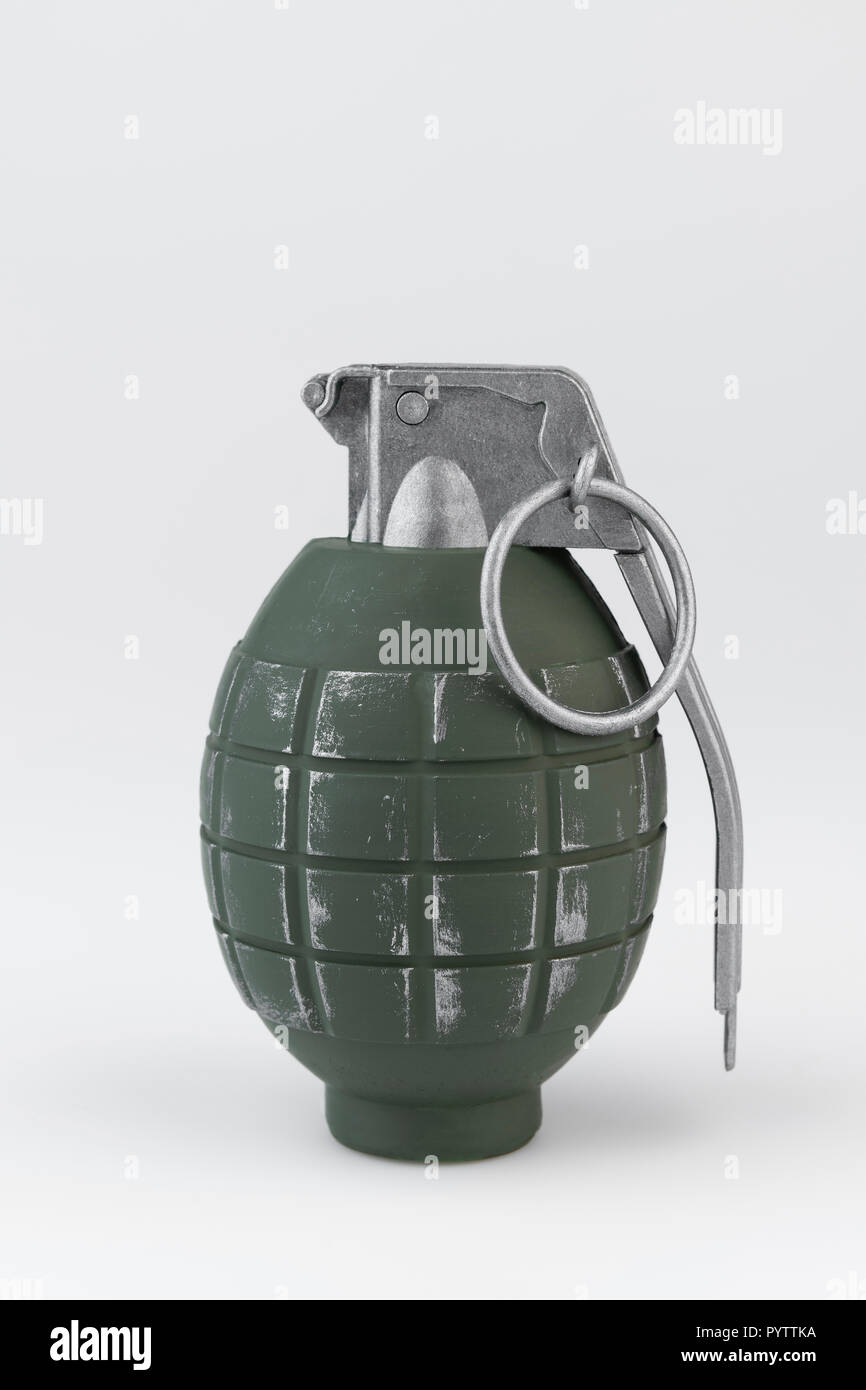 Green metal hand grenade against a white background Stock Photo - Alamy