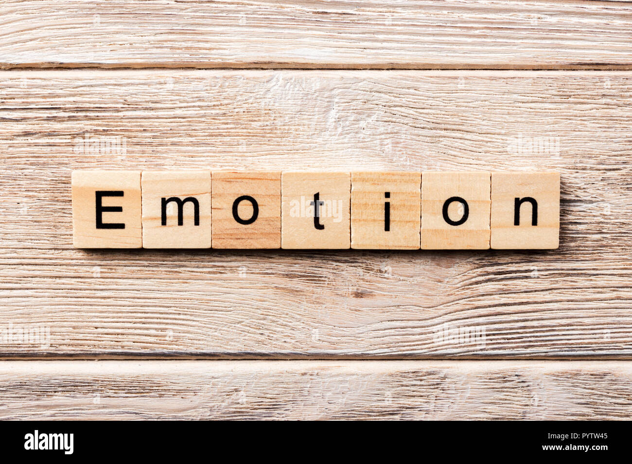emotion word written on wood block. emotion text on table, concept ...