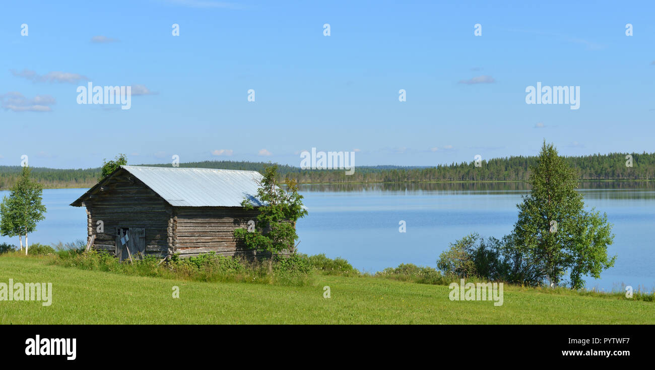 Summer northern landscape with barn on shore of forest lake. Finland ...