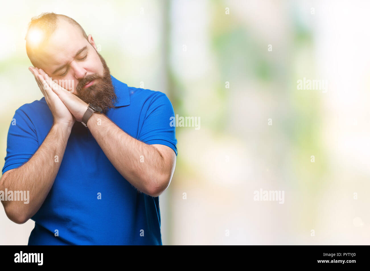 Young caucasian hipster man wearing blue shirt over isolated background ...