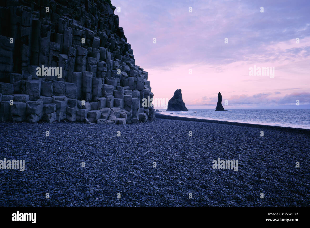 The black lava sand beach of Reynisfjara and the Reynisdrangar basalt ...