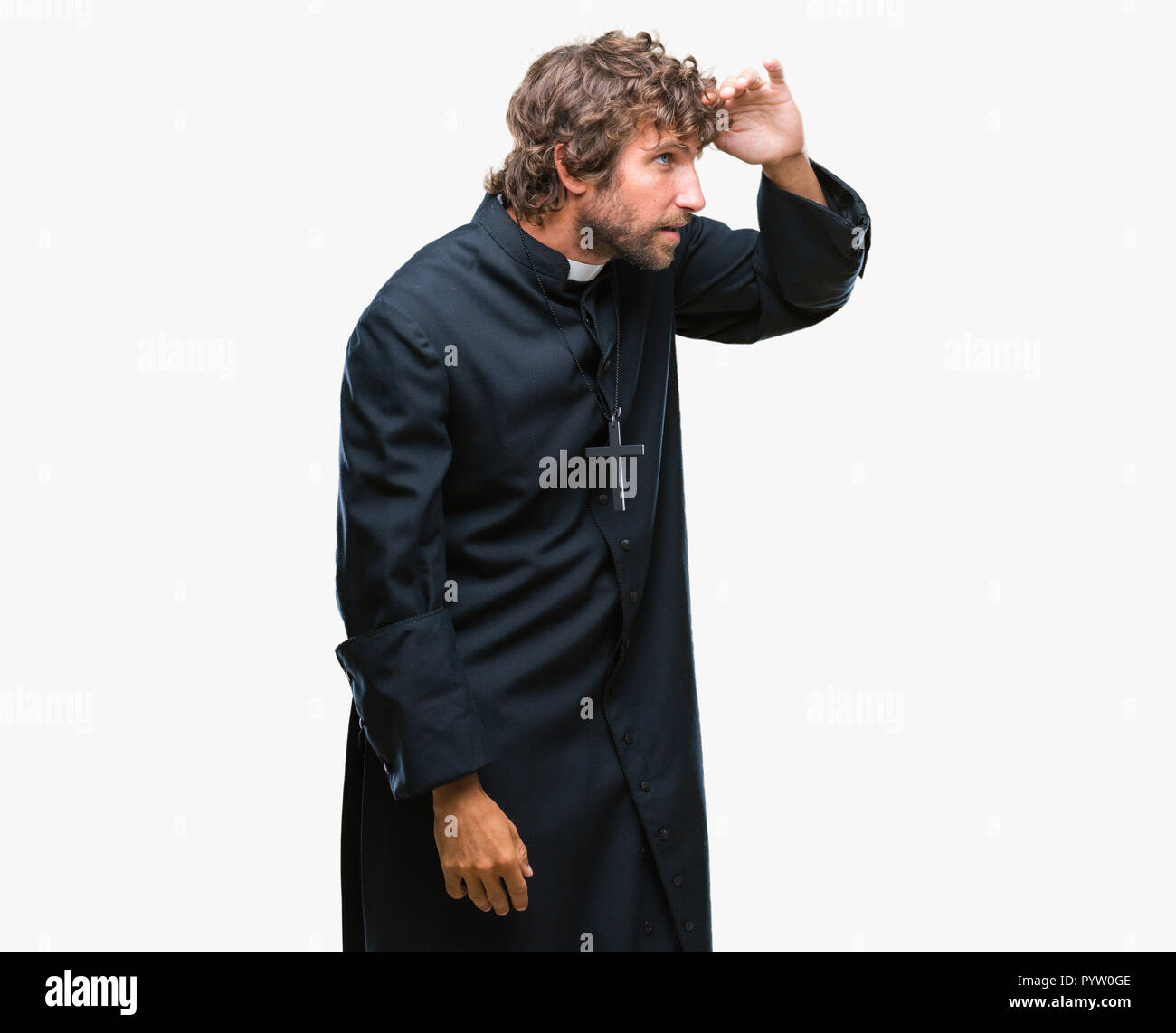 Handsome hispanic catholic priest man over isolated background very ...
