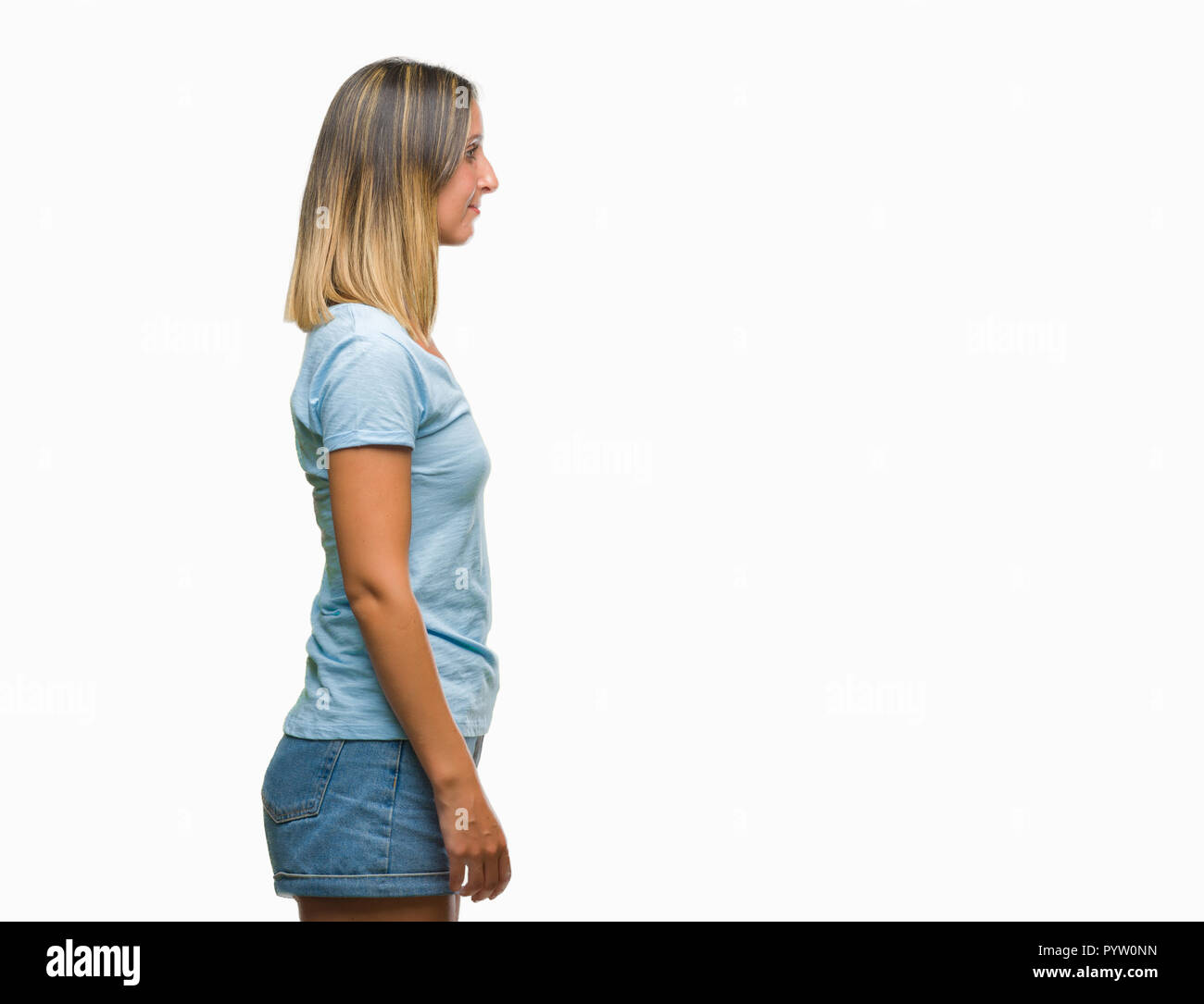 Young beautiful woman over isolated background looking to side, relax ...