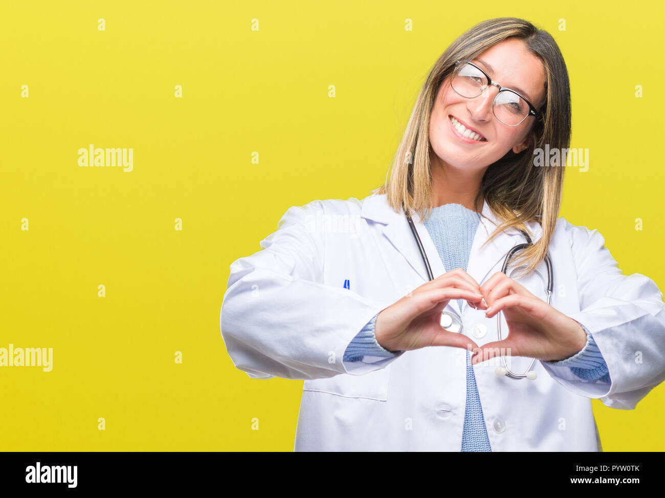 Young beautiful doctor woman headphones over isolated background ...