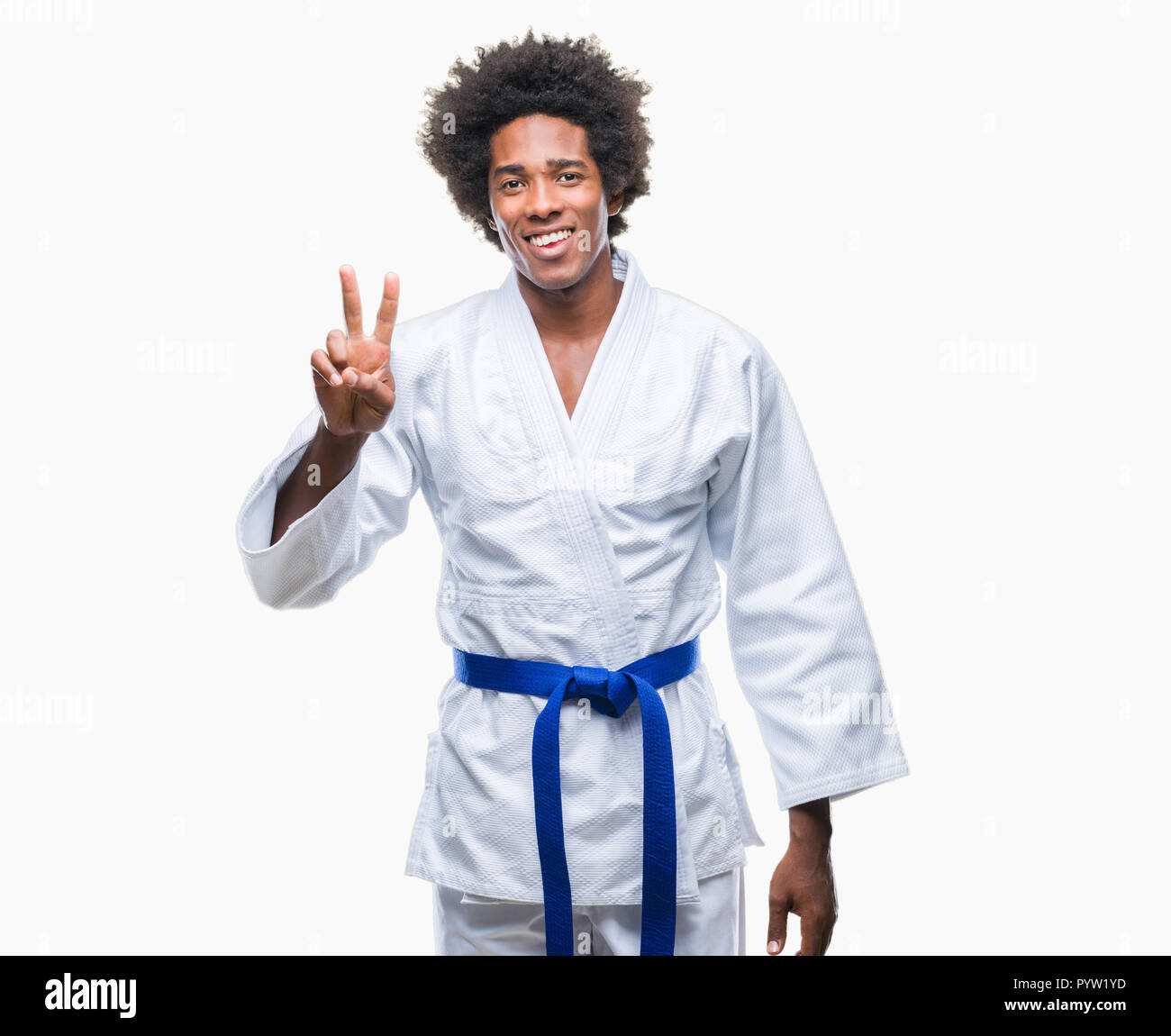 Afro american man wearing karate kimono over isolated background ...