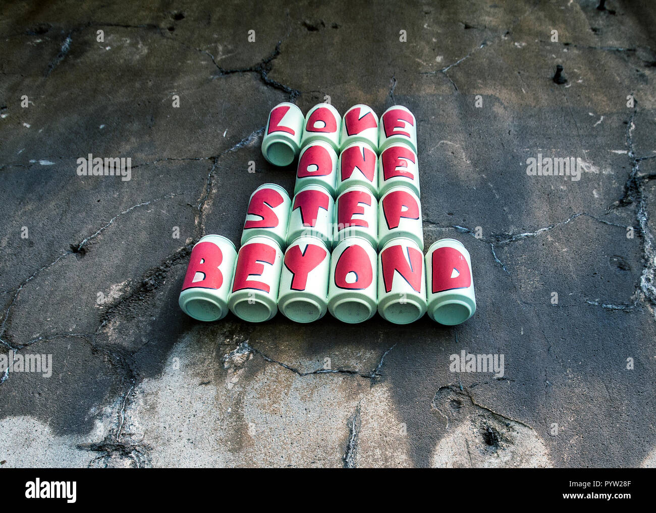 'Love one step beyond' conceptual street art ,tin cans as 3d wall art ...