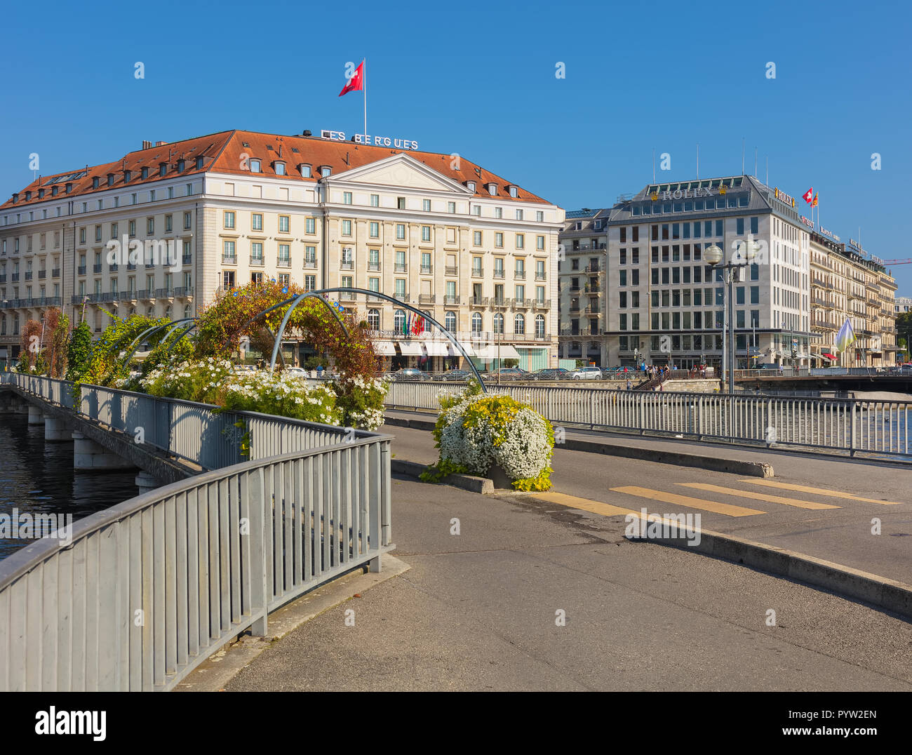Pont des Bergues bridge over the Rhone river, buildings of the city of ...