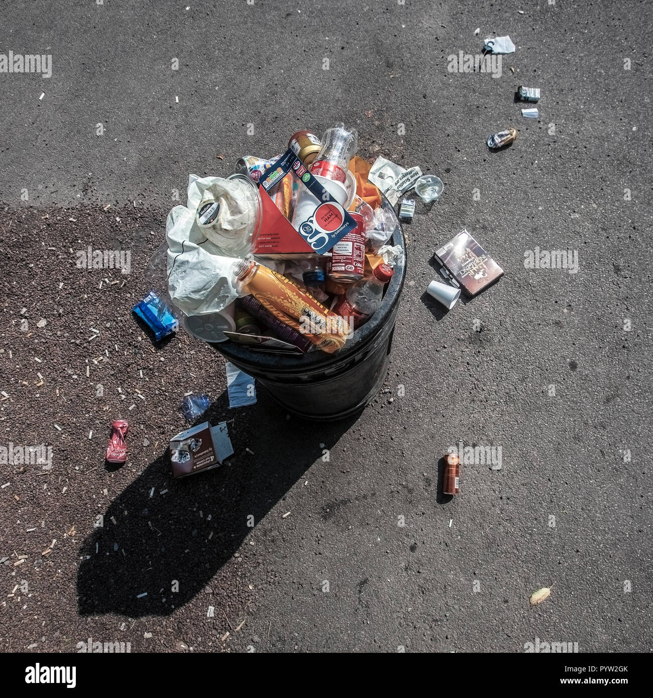 overflowing rubbish bin in park Stock Photo - Alamy