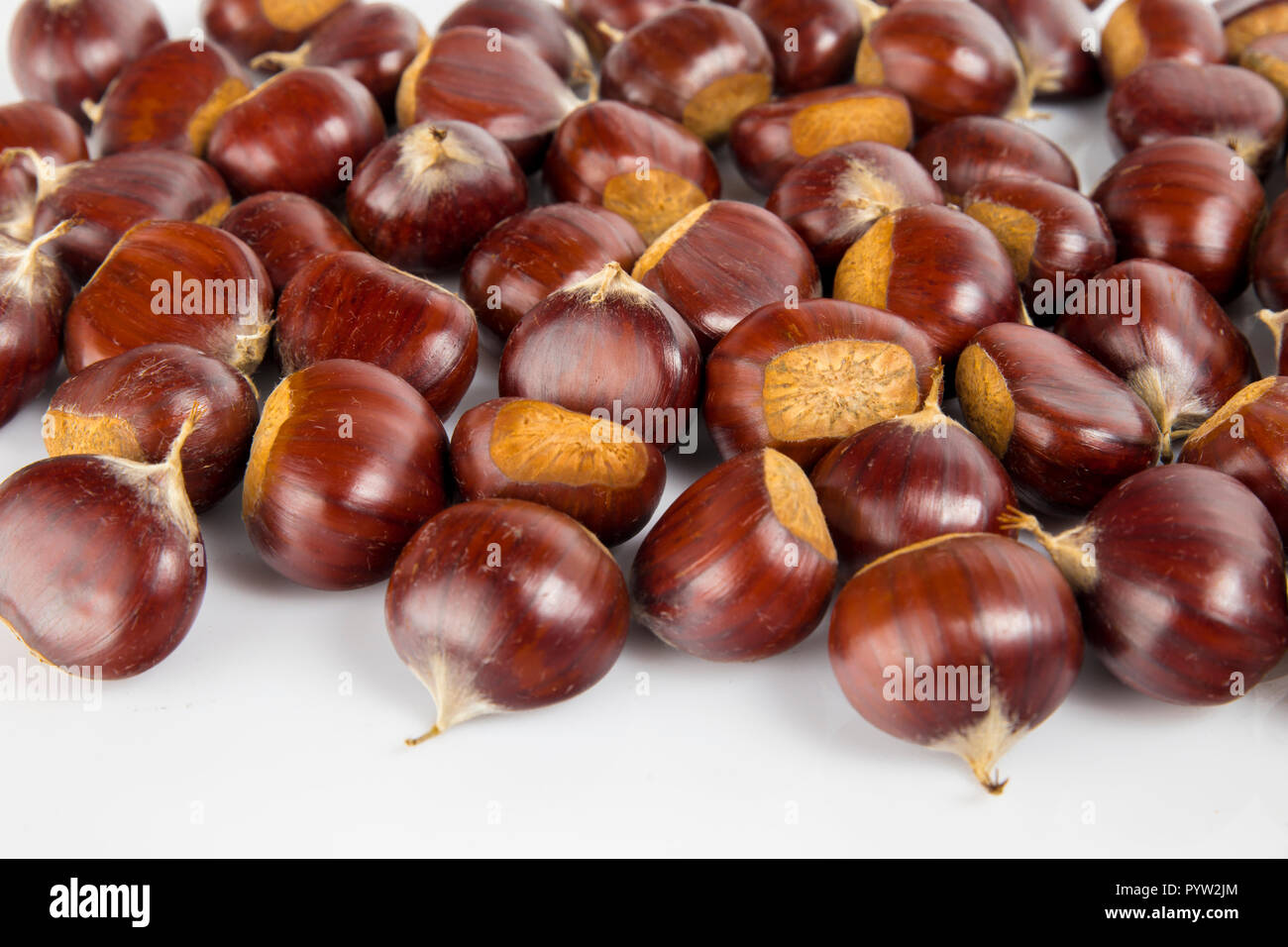 Fresh chestnuts with peeled roasted chestnut isolated on white ...