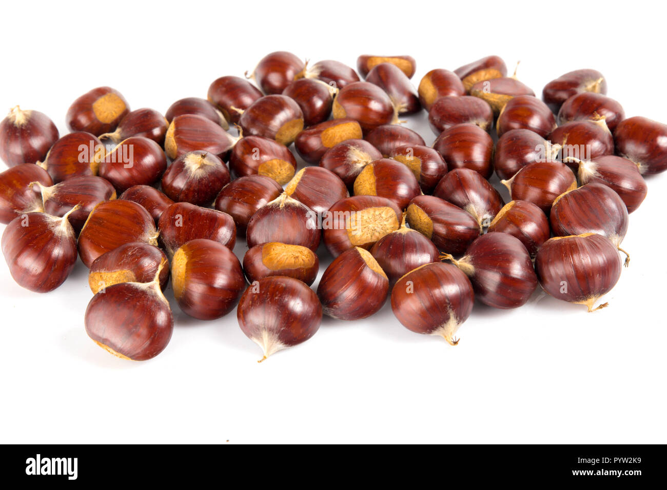 Fresh chestnuts with peeled roasted chestnut isolated on white ...