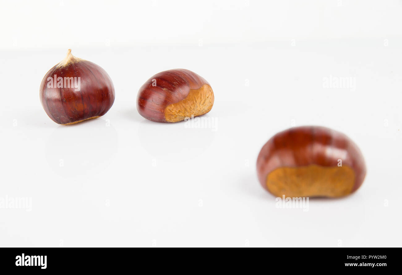 Fresh chestnuts with peeled roasted chestnut isolated on white ...