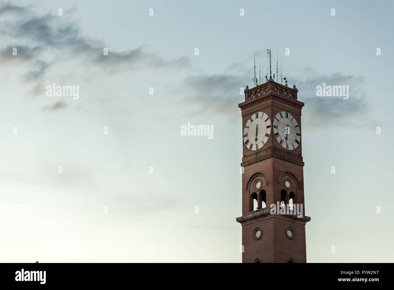 ancient clock tower on sky background Stock Photo - Alamy