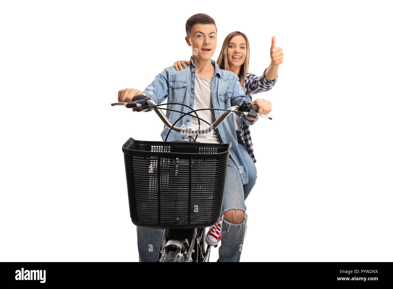 Smiling boy and girl riding on the same bike and giving thumbs up ...