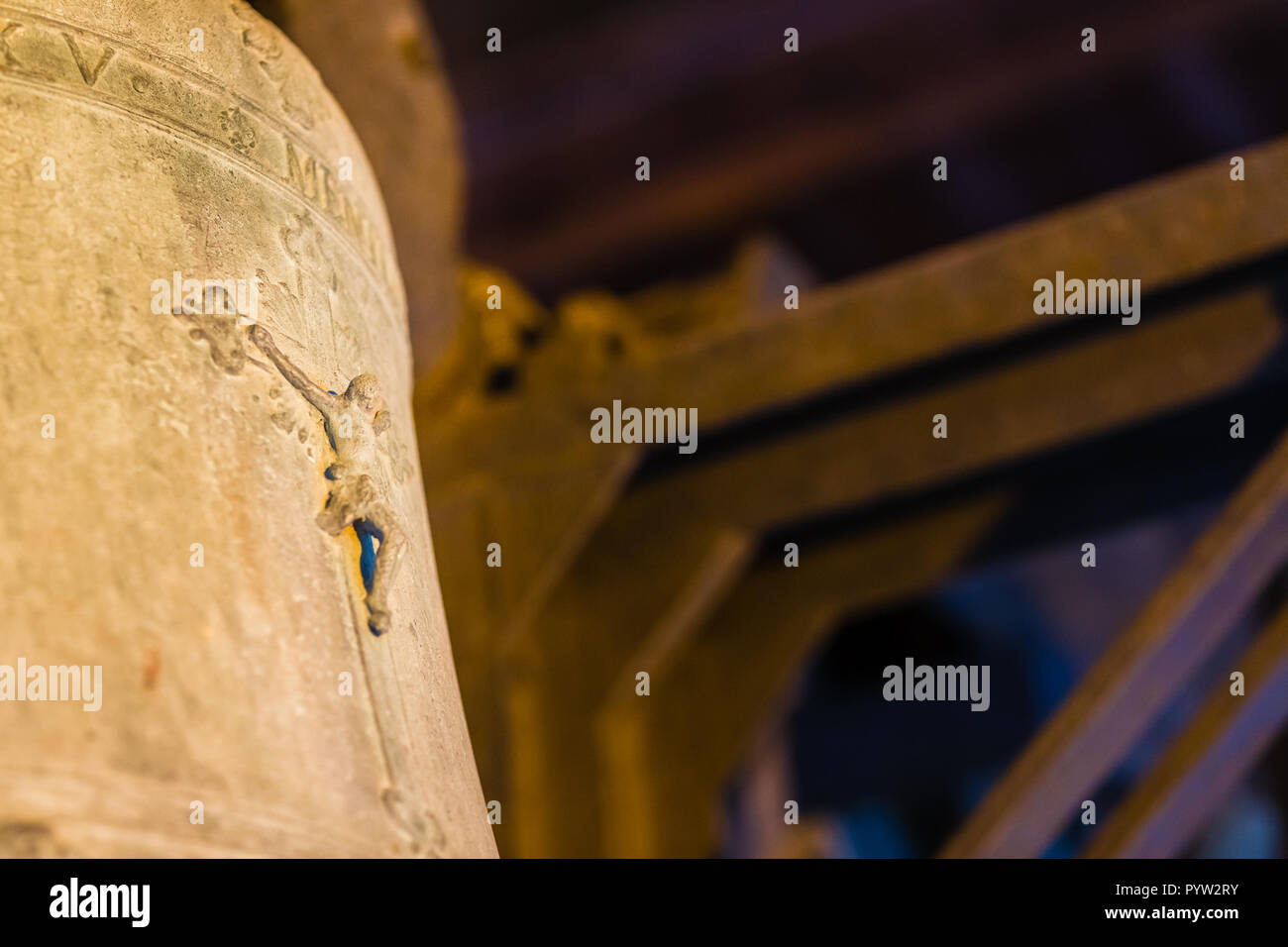 Crucifixion of Jesus Christ on ancient bronze bell in tower Stock Photo ...
