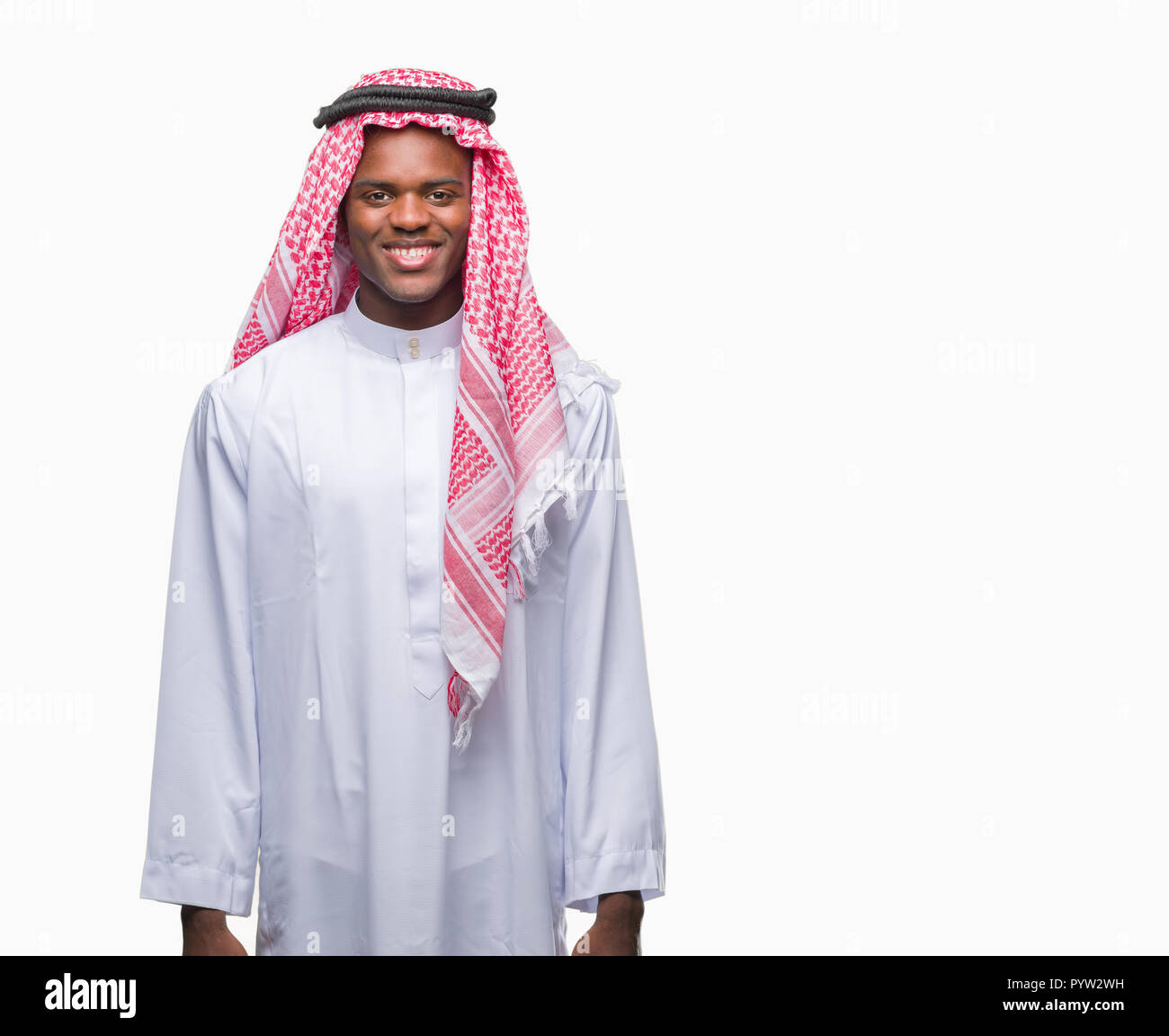 Young arabic african man wearing traditional keffiyeh over isolated ...