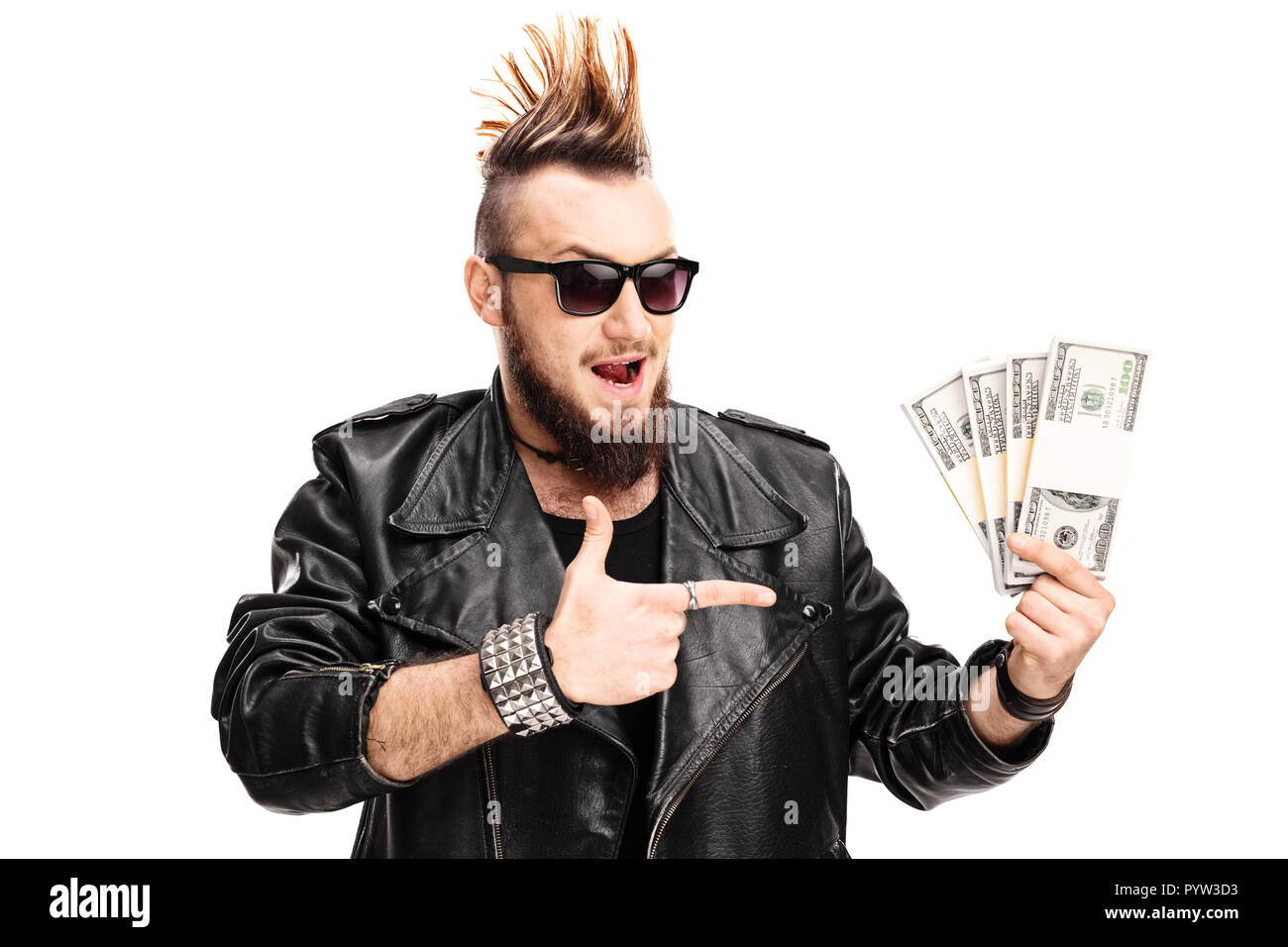 Punker in a leather jacket holding money and pointing isolated on white ...