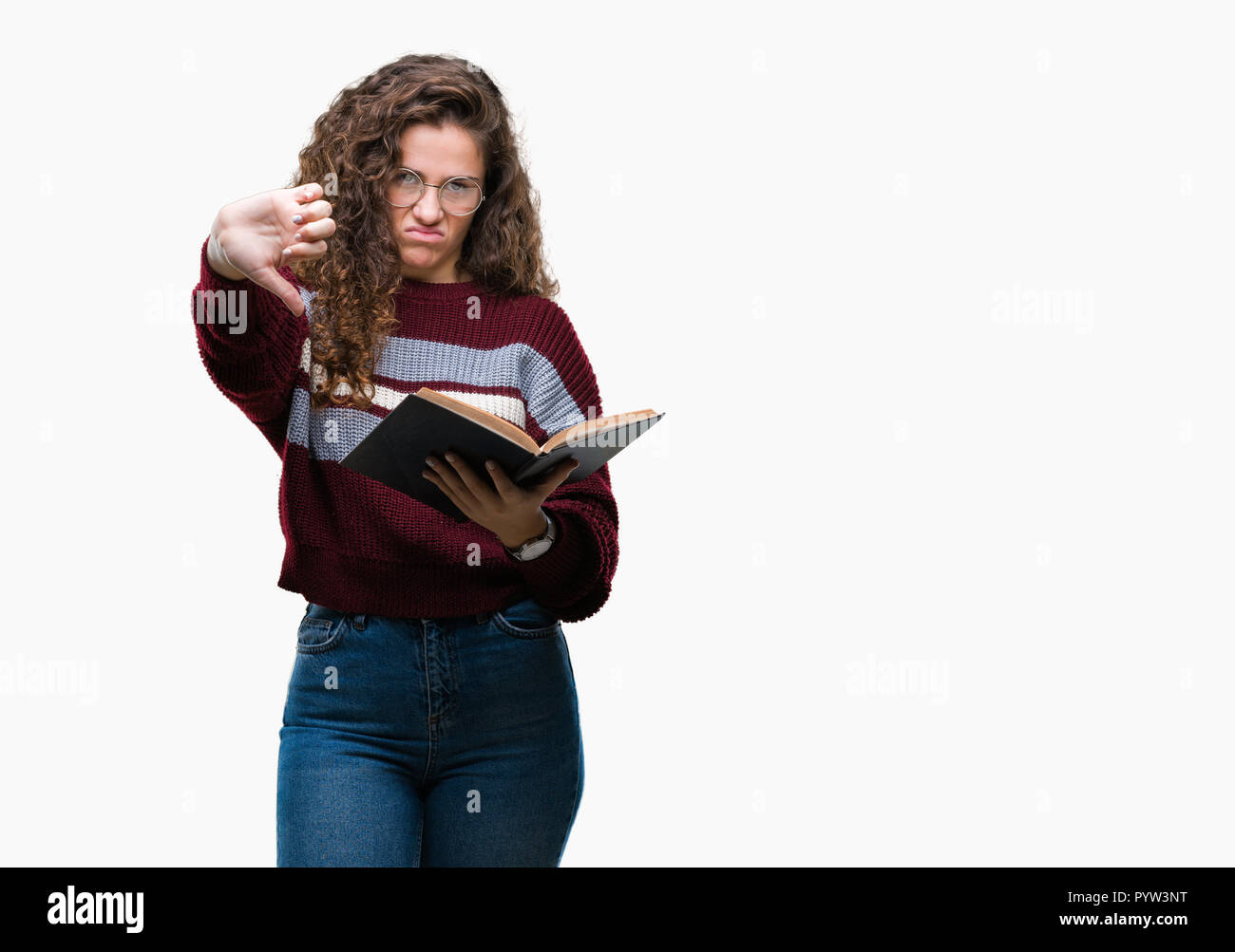 Young brunette girl reading a book wearing glasses over isolated ...