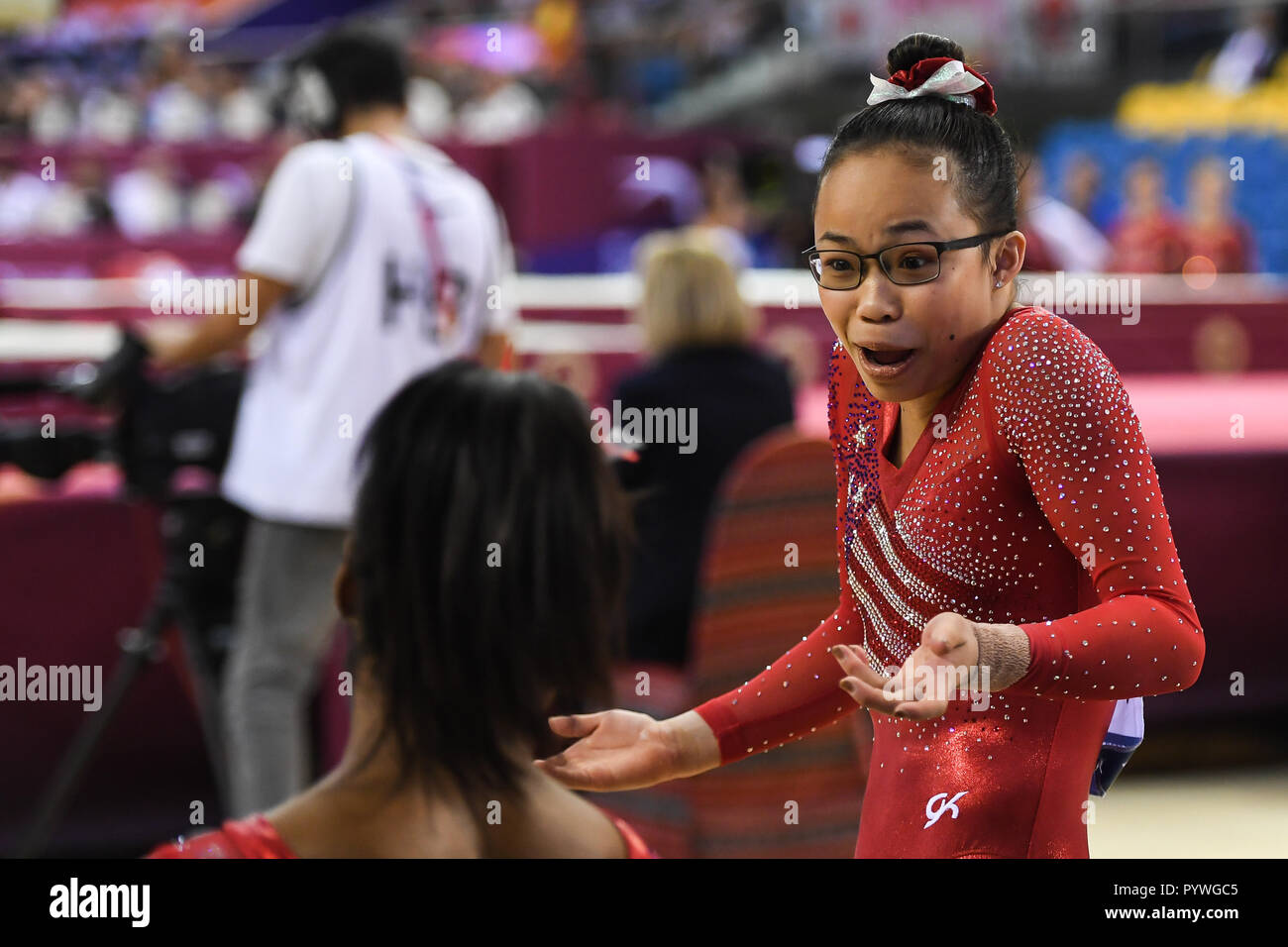Doha, Qatar. 30th Oct, 2018. MORGAN HURD talks with SIMONE BILES during ...