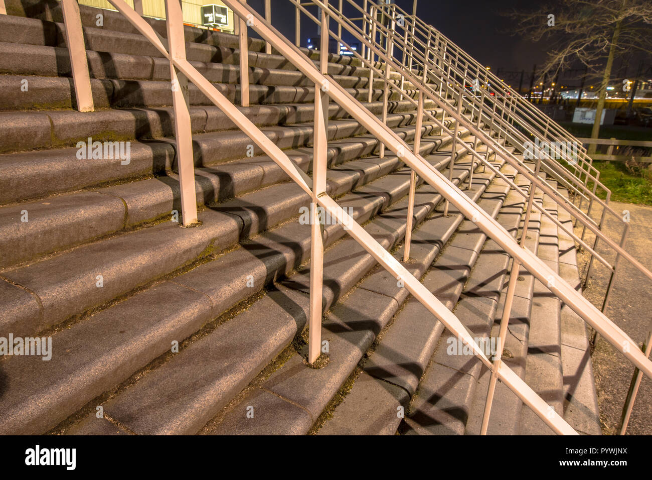 Wide stairs for thousands of spectator audiance at a football stadium ...