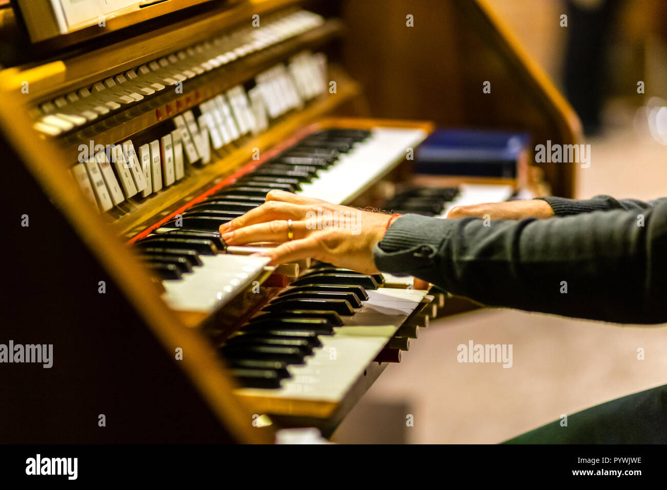 male hands playing organ keyboard in church Stock Photo - Alamy