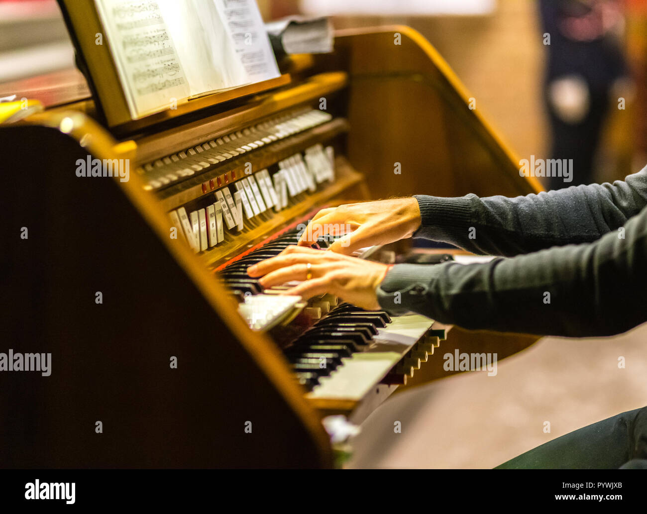 male hands playing organ keyboard in church Stock Photo - Alamy