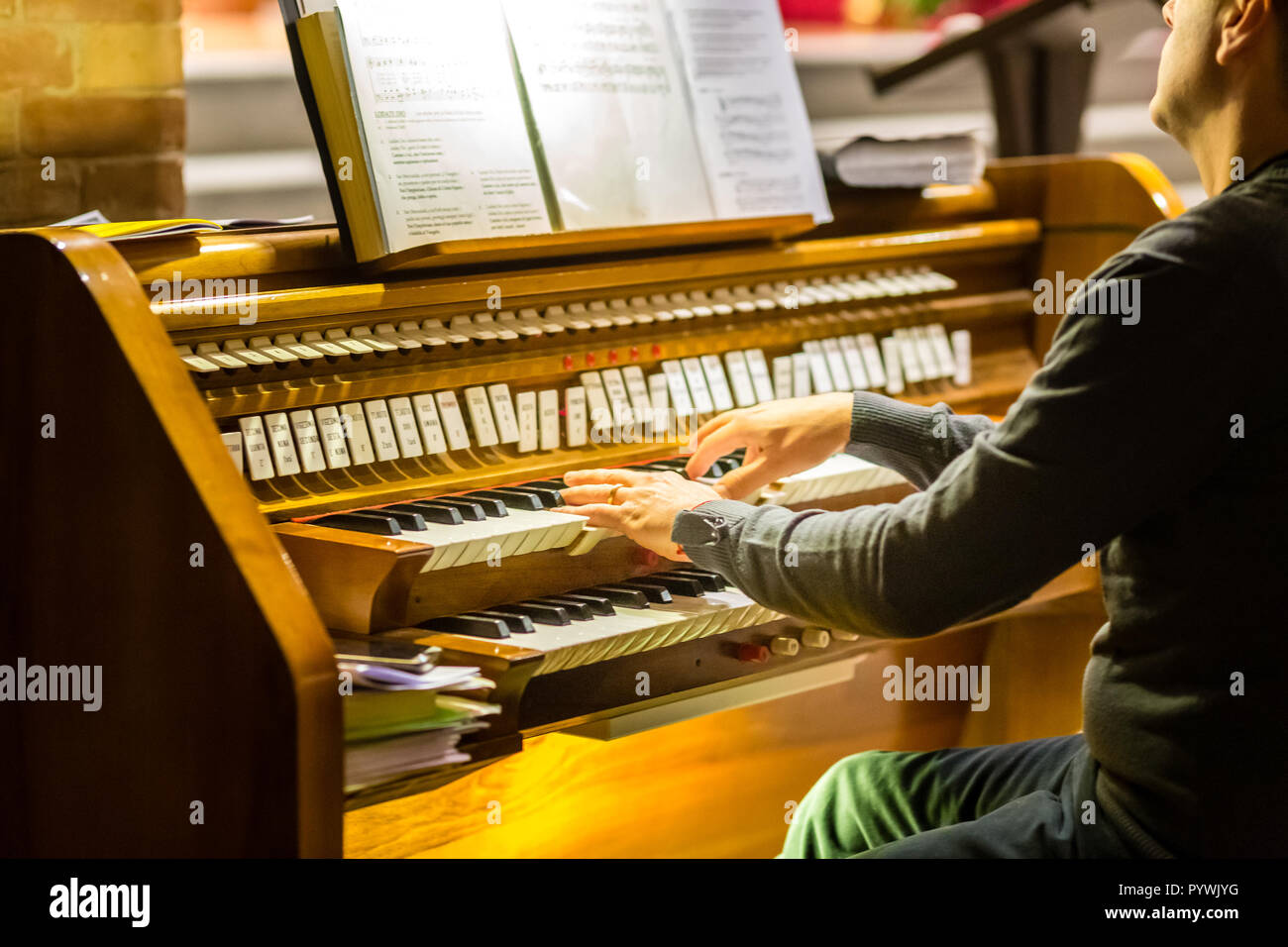 male hands playing organ keyboard in church Stock Photo - Alamy