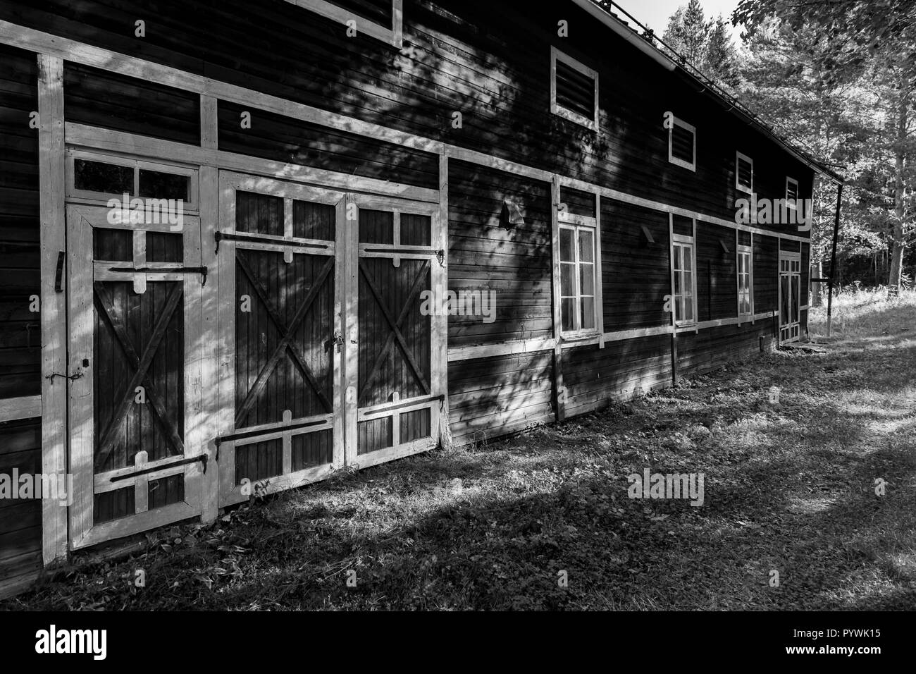 Barn door and window in an old Swedish farm in northern Sweden Stock ...