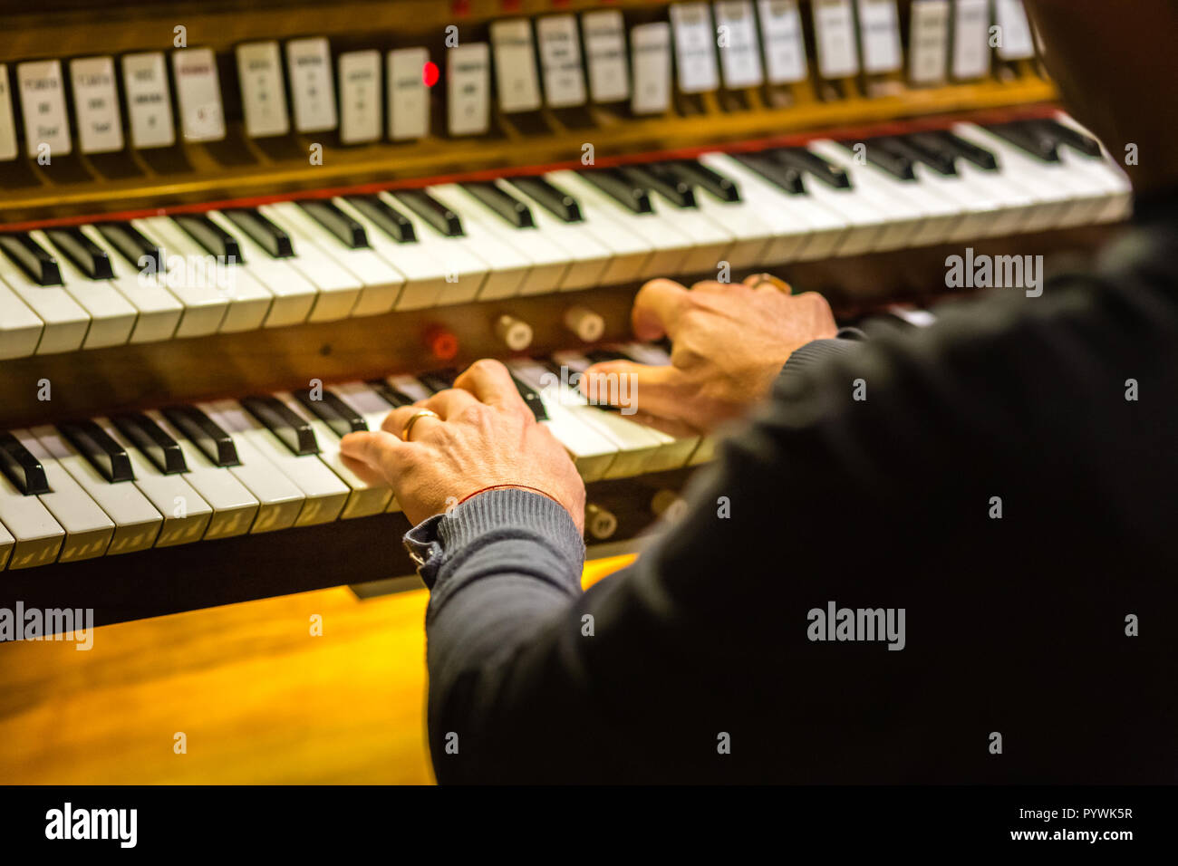 male hands playing organ keyboard in church Stock Photo - Alamy